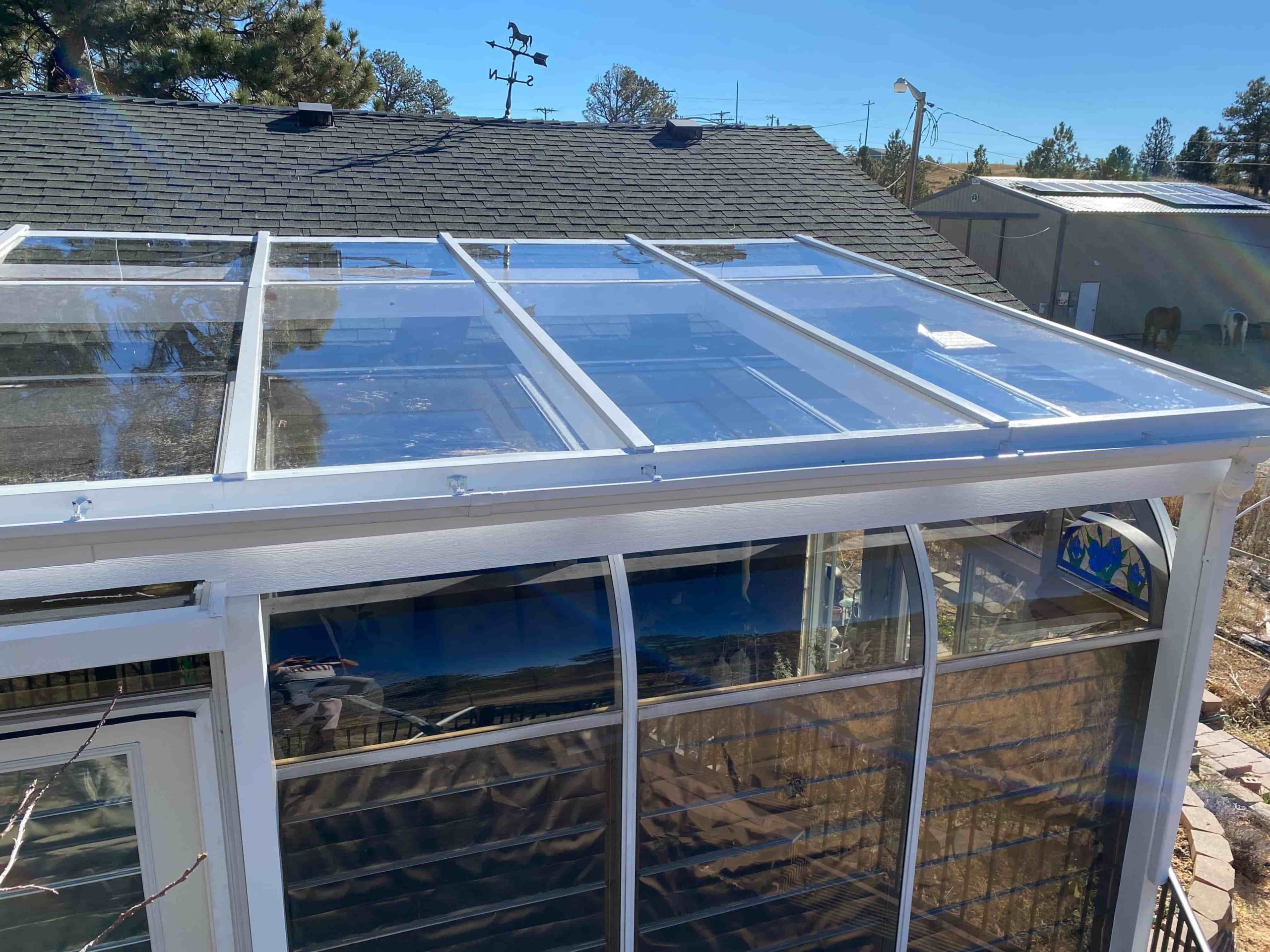 Plexiglass roof cover over the sunroom in Parker, Colorado